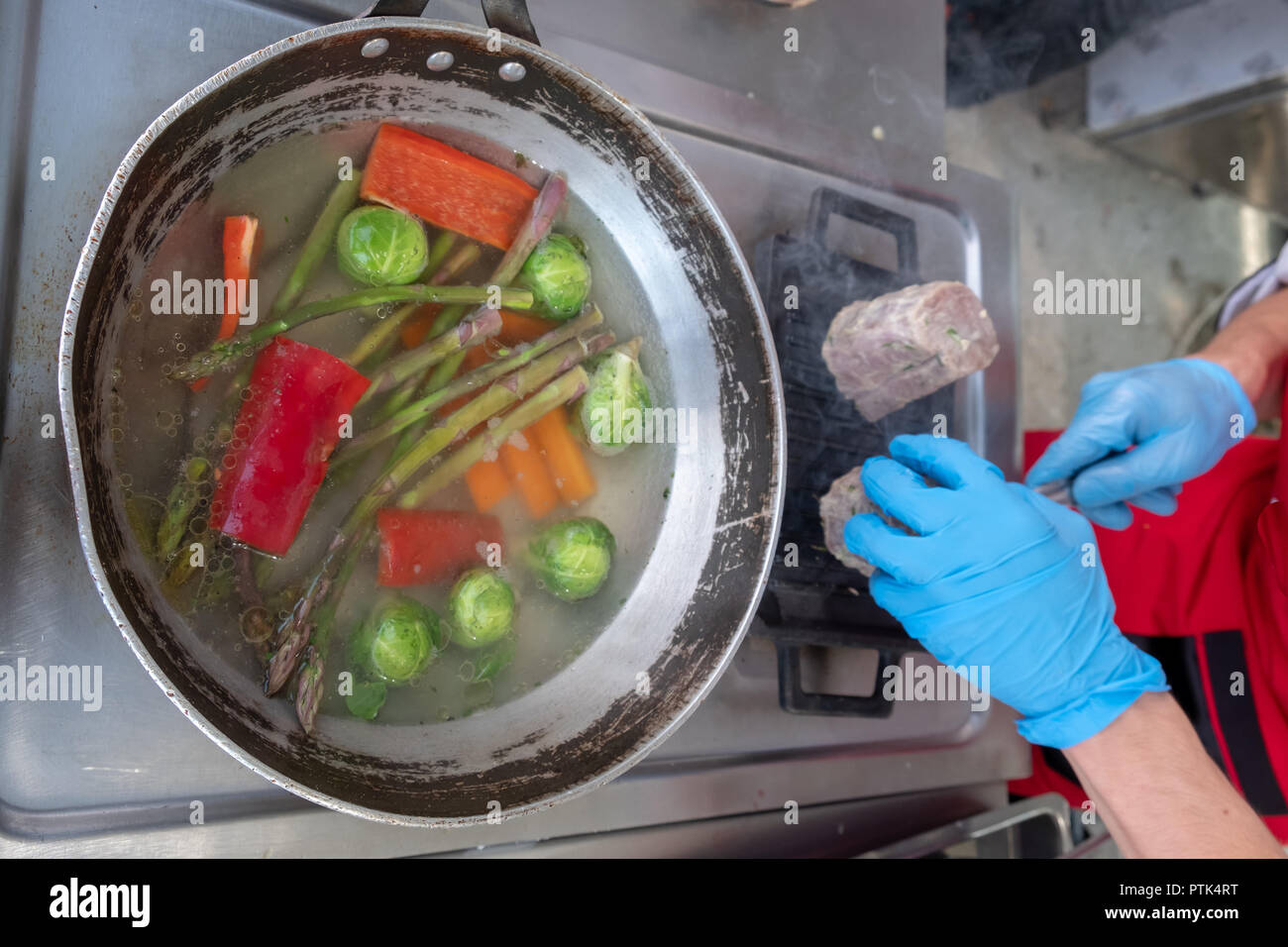 Chef in hotel or restaurant kitchen cooking only hands Stock Photo - Alamy