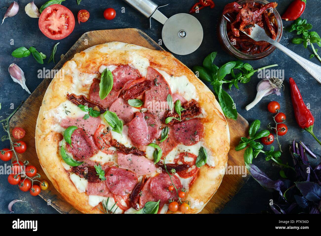 Traditional Fresh Italian pizza with dried salami tomatoes mozzarella ...