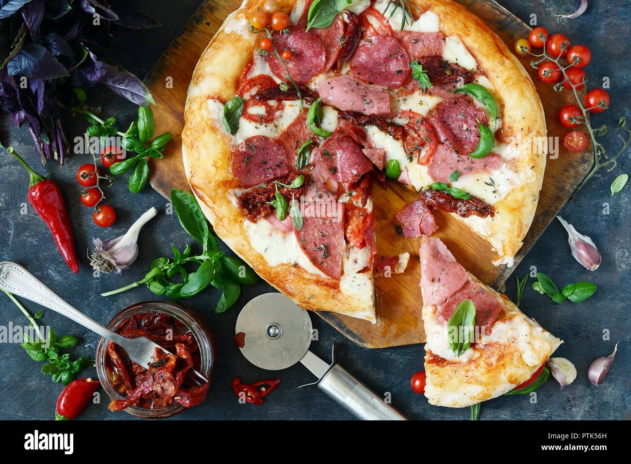 Traditional Fresh Italian pizza with dried salami tomatoes mozzarella ...