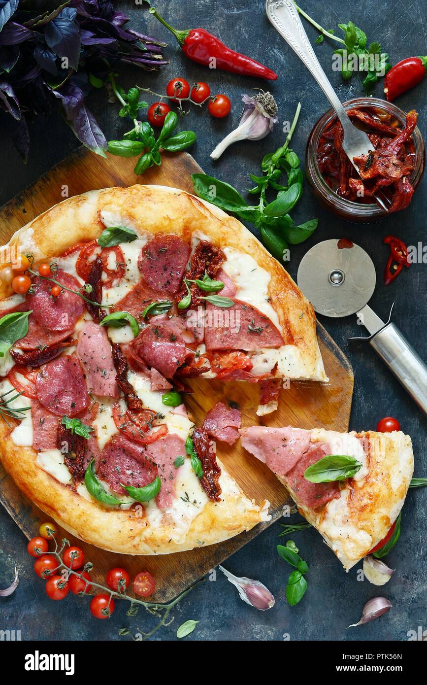 Traditional Fresh Italian pizza with dried salami tomatoes mozzarella ...
