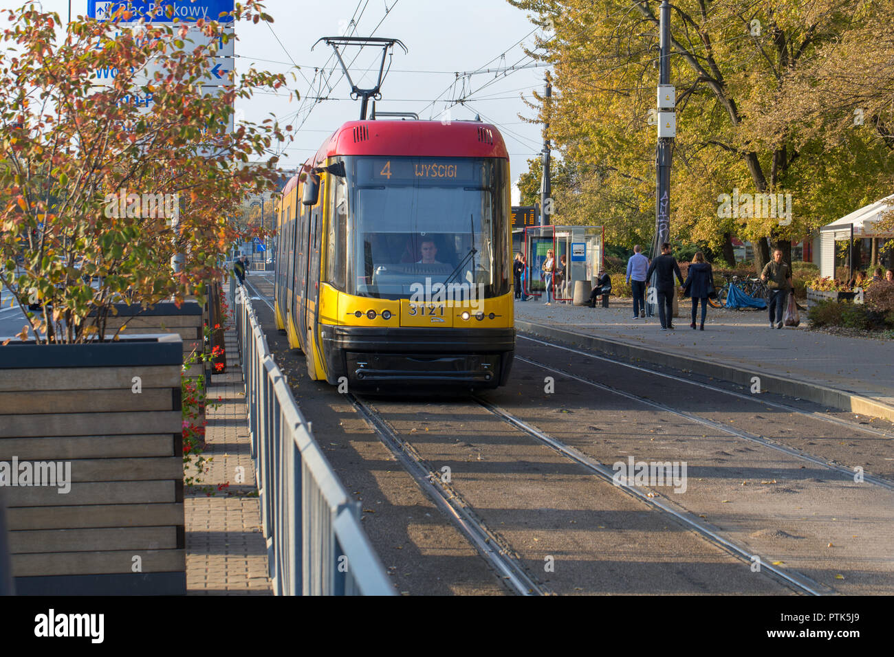 Yellow Pesa Swing 120Na tram in Warsaw, Poland Stock Photo - Alamy