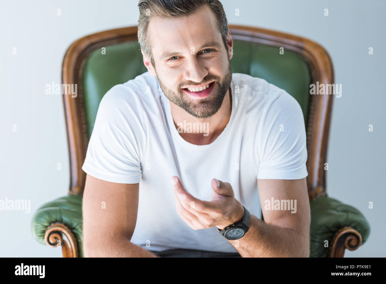 Man in green armchair hi-res stock photography and images - Alamy