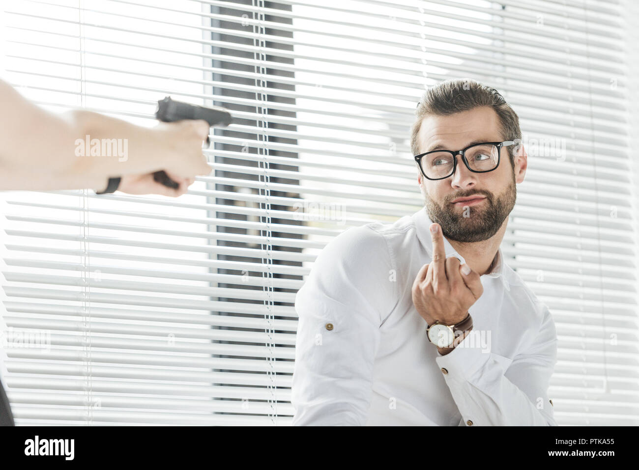 Businessman finger gun hi-res stock photography and images - Alamy