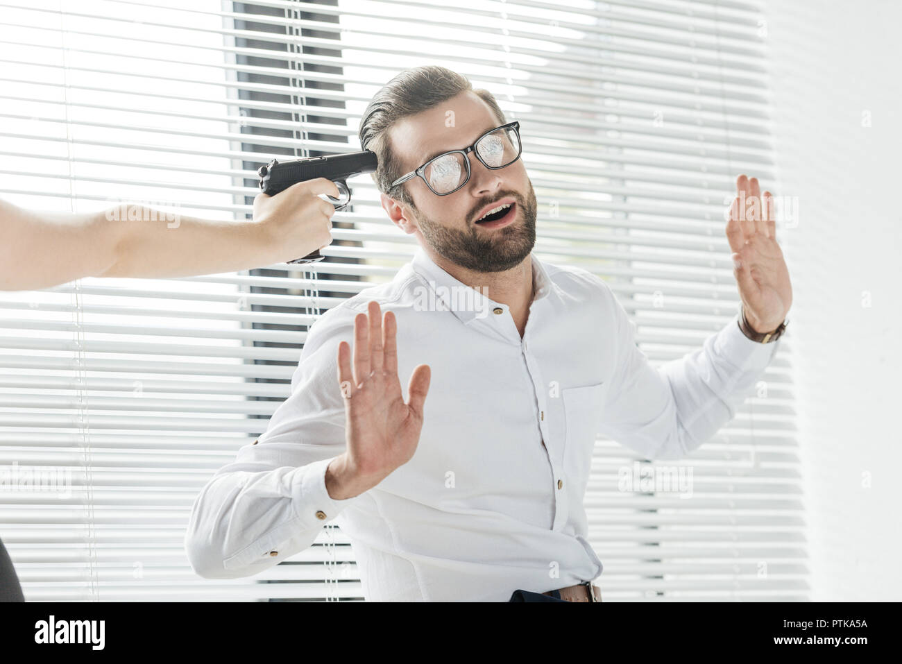 Man holding gun head hi-res stock photography and images - Alamy