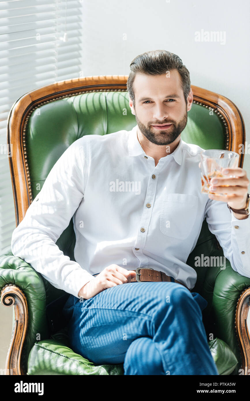 Man sitting in armchair glass hi-res stock photography and images - Alamy