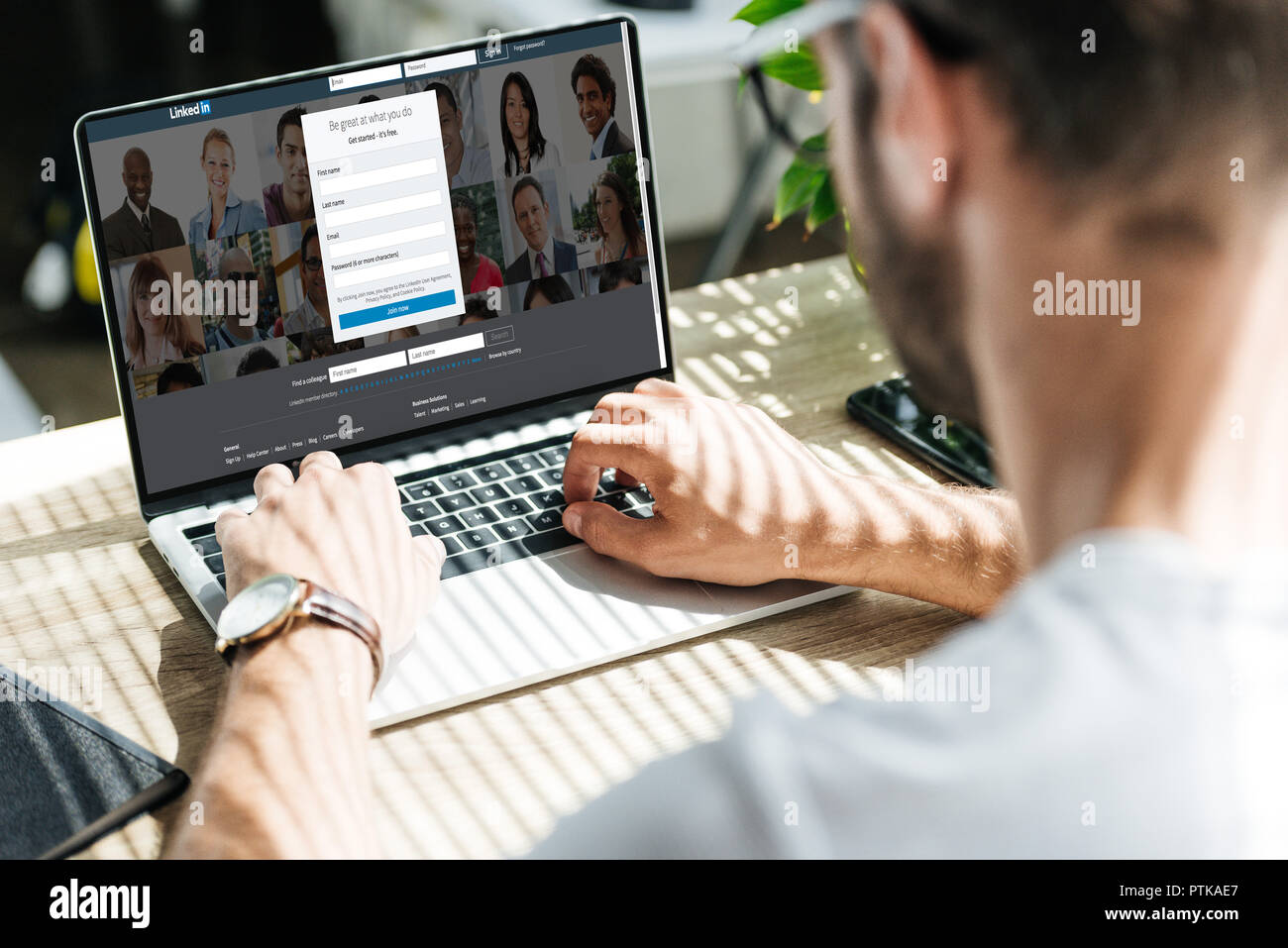 partial view of man using laptop with linkedin website on screen Stock ...