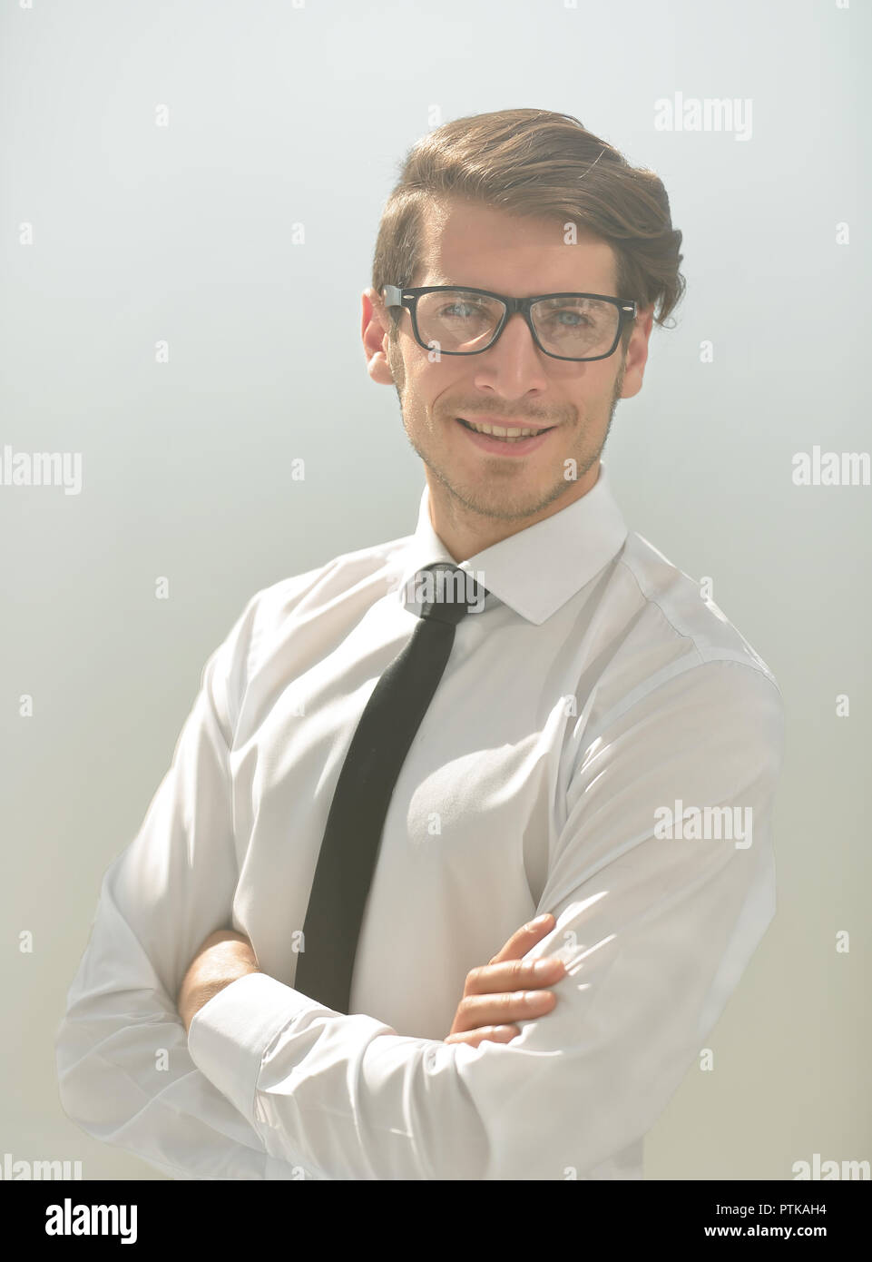 successful young businessman on a bright background Stock Photo - Alamy