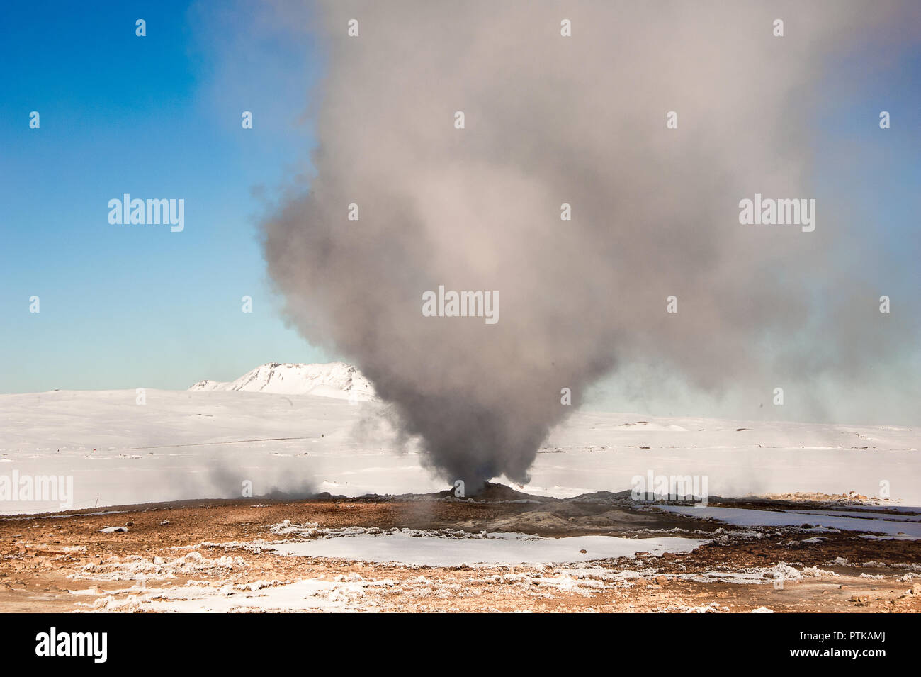 Giant smoke plume rises from a fumarole in Hverir geothermal area ...