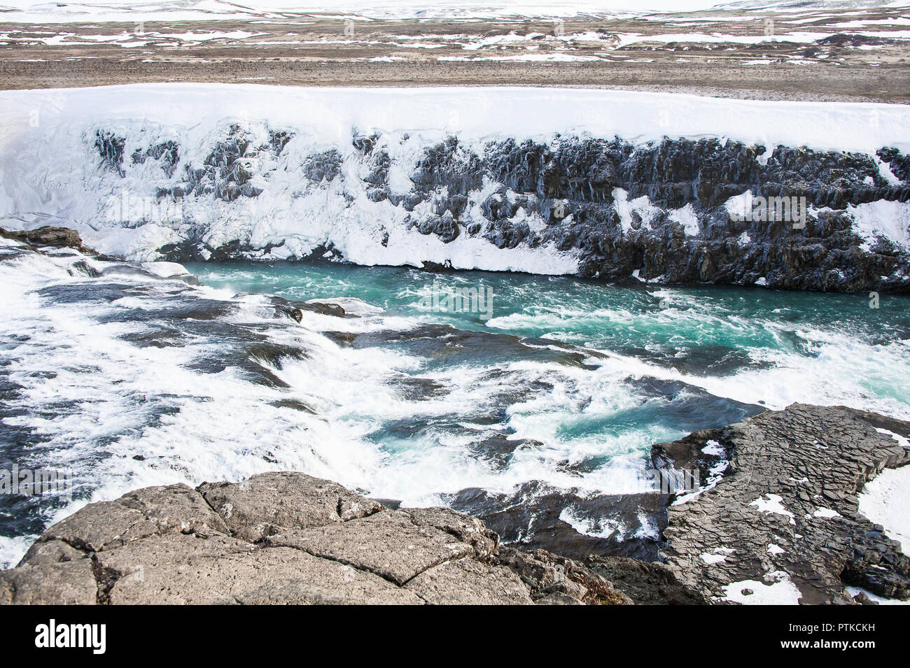 Gullfoss Waterfall on the Hvita river, Iceland. Rocky foreground, fast ...