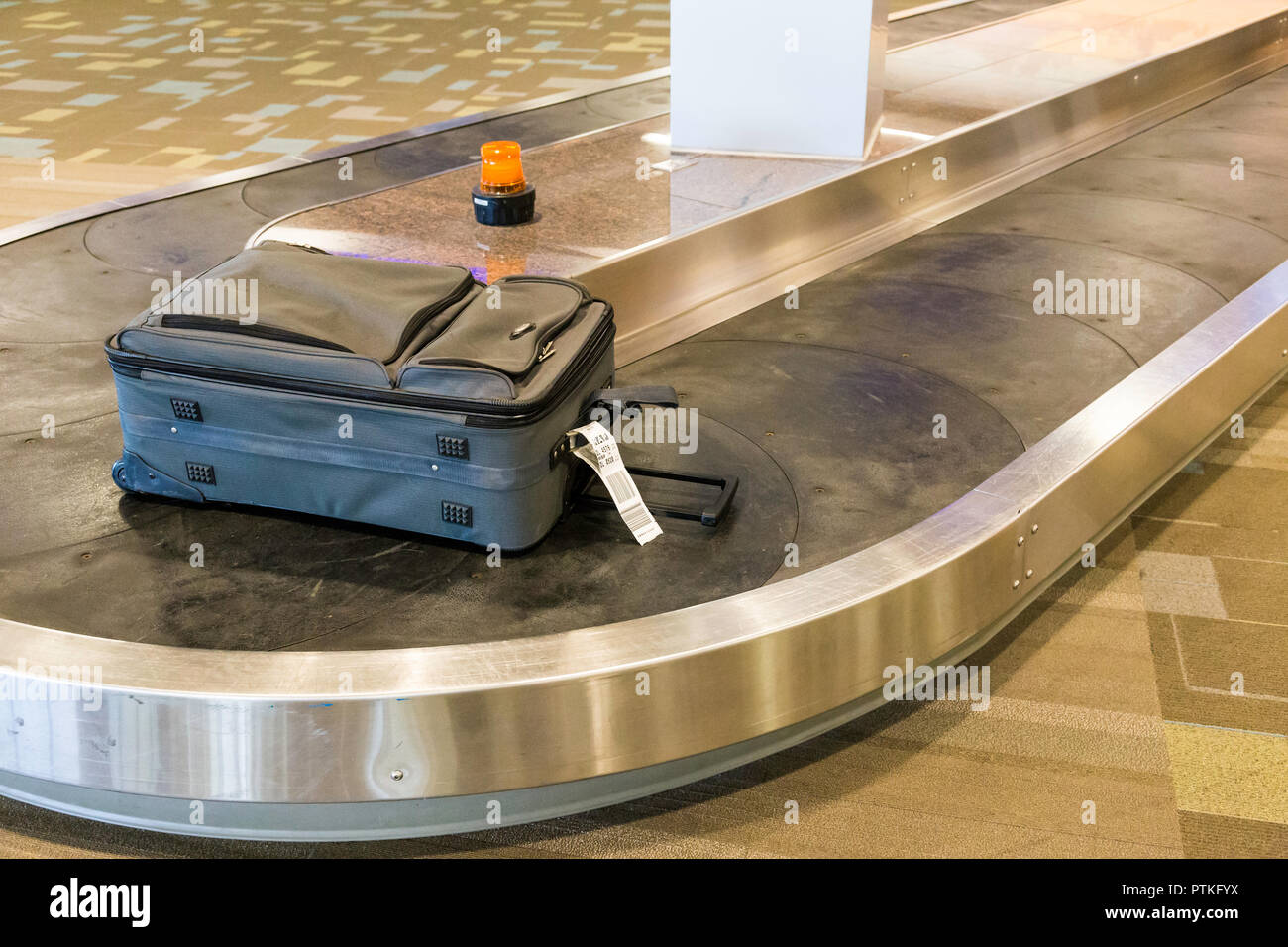 Lost Suitcase at Airport Baggage Claim Area, USA Stock Photo - Alamy