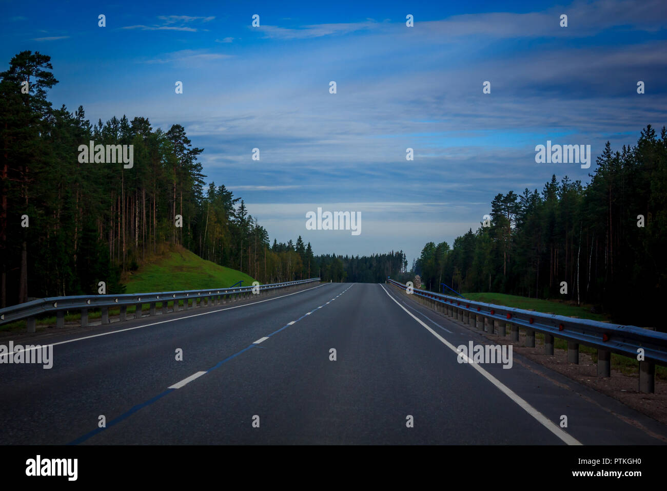 Russian roads in Karelia. Travel by road. Asphalt road. Smooth road car ...