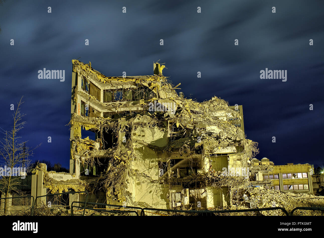Apocalyptic photo of a heavily damaged concrete office building. Only ...