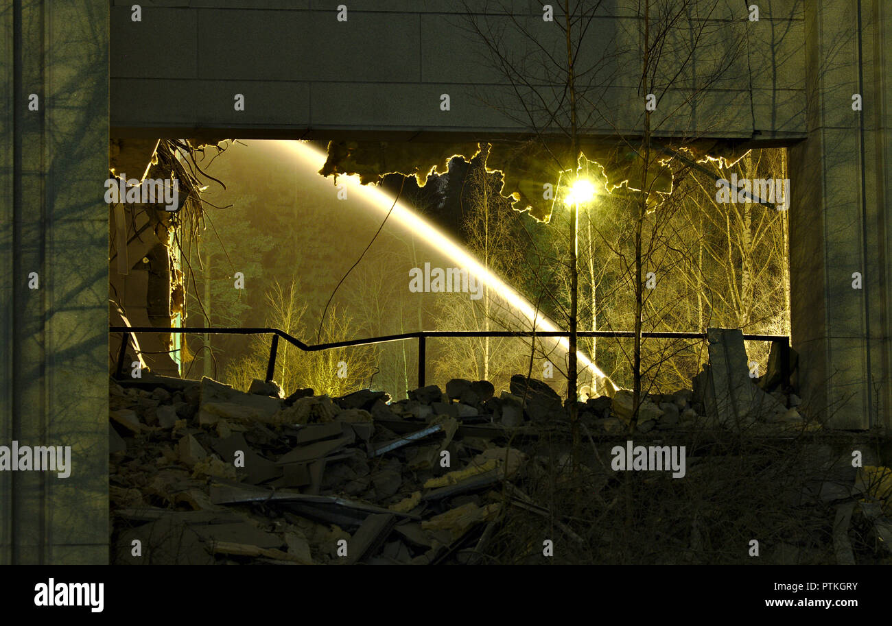 A view through collapsed building with only wall still standing. Water ...