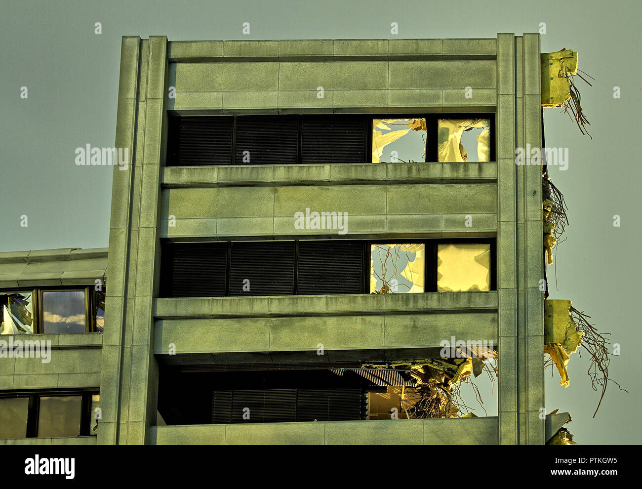 Only one wall of destroyed building still standing. Dramatic low light ...