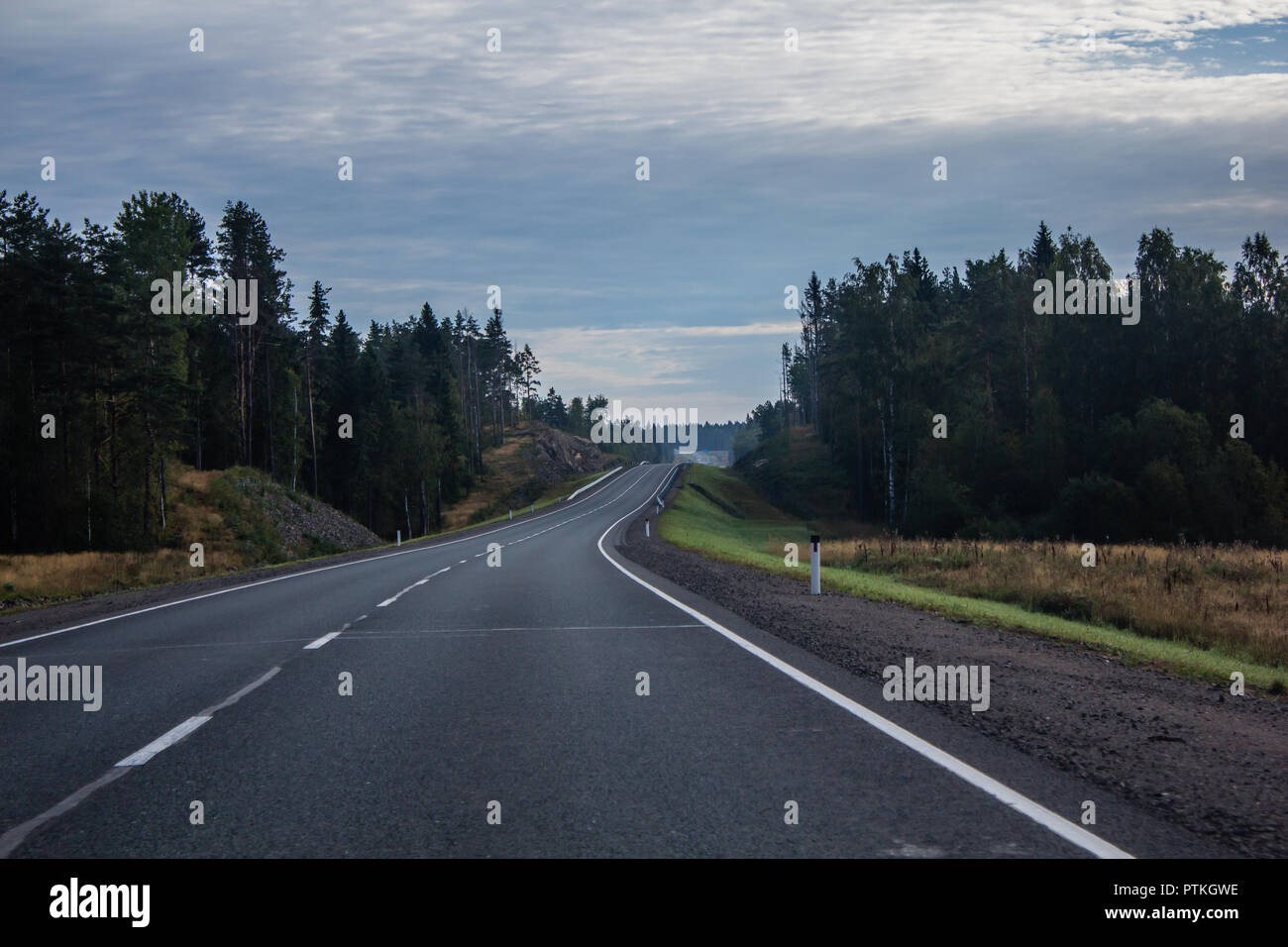 Russian roads in Karelia. Travel by road. Asphalt road. Smooth road car ...