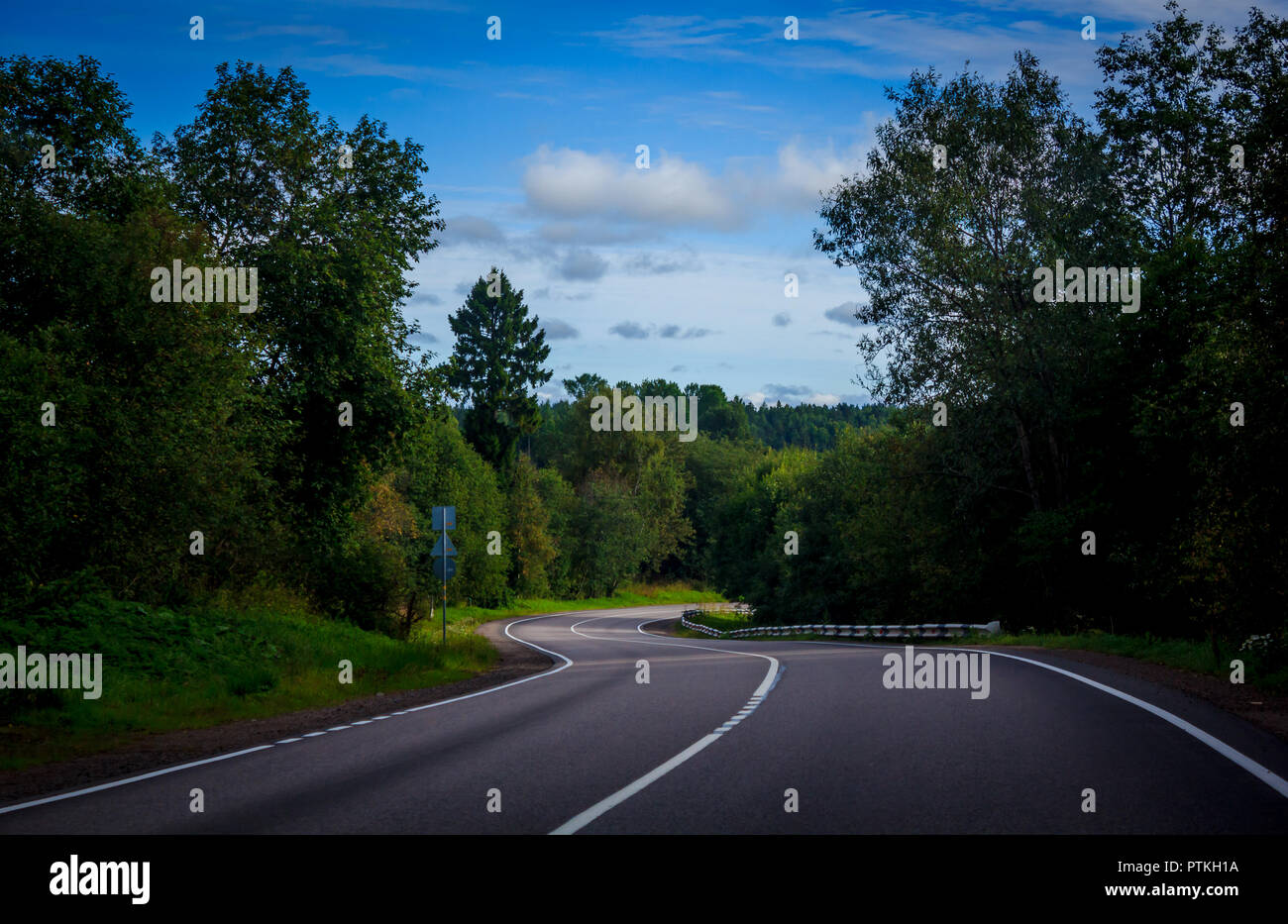 Russian roads in Karelia. Travel by road. Asphalt road. Smooth road car ...
