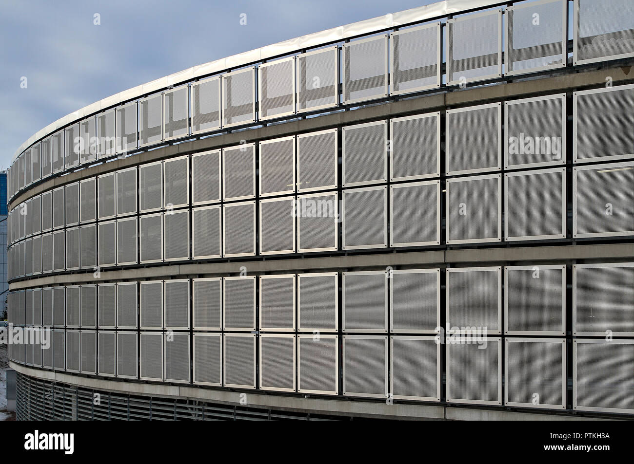 Round shaped parking lot, four floors. Shiny steel net walls Stock ...