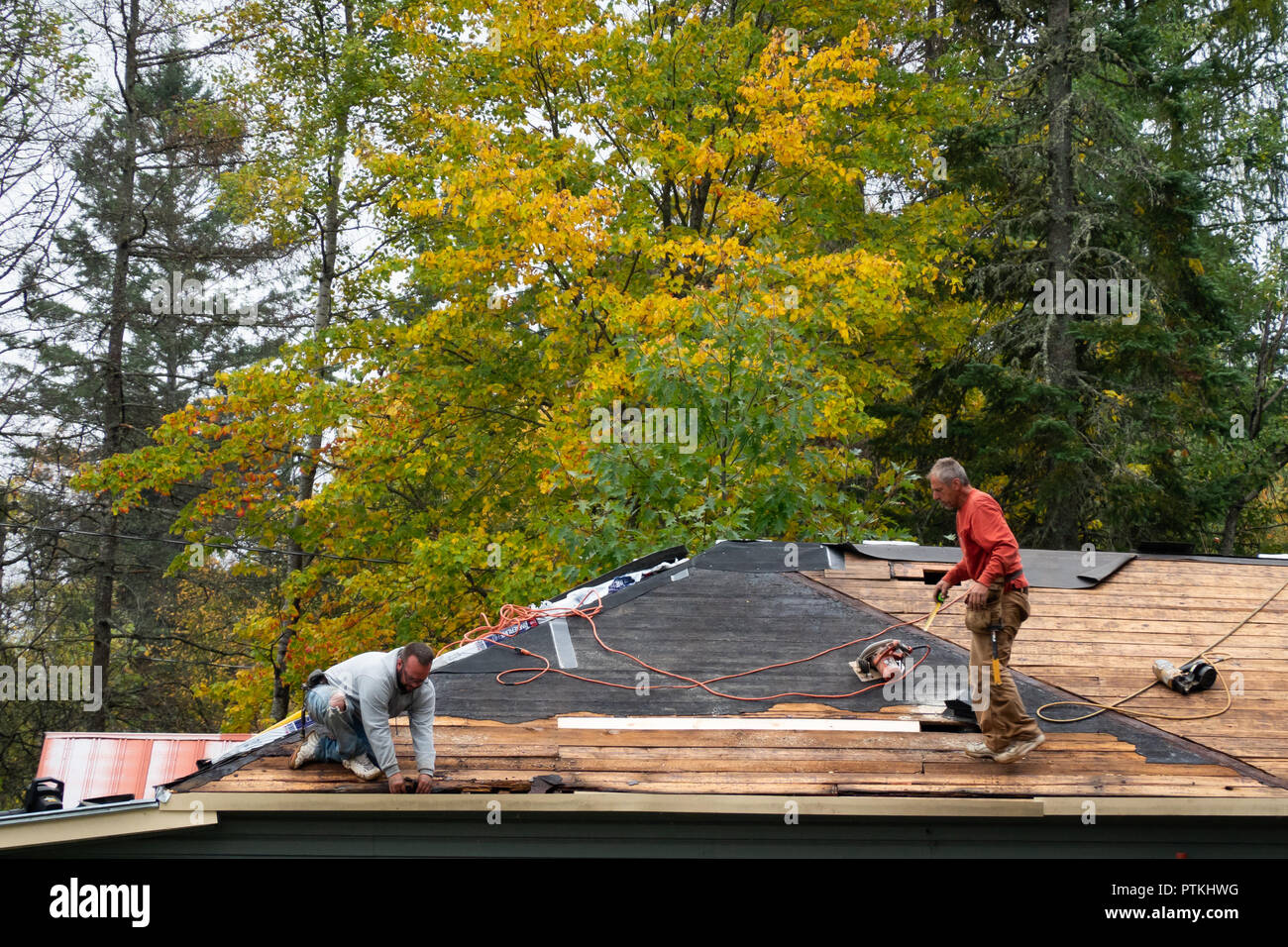 Roof shingles worker hi-res stock photography and images - Alamy