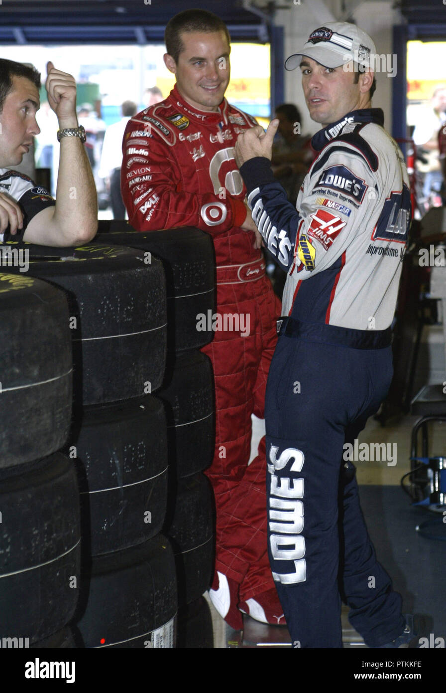 Casey Mears (L) and Jimmie Johnson(R) talk in the garage prior to ...