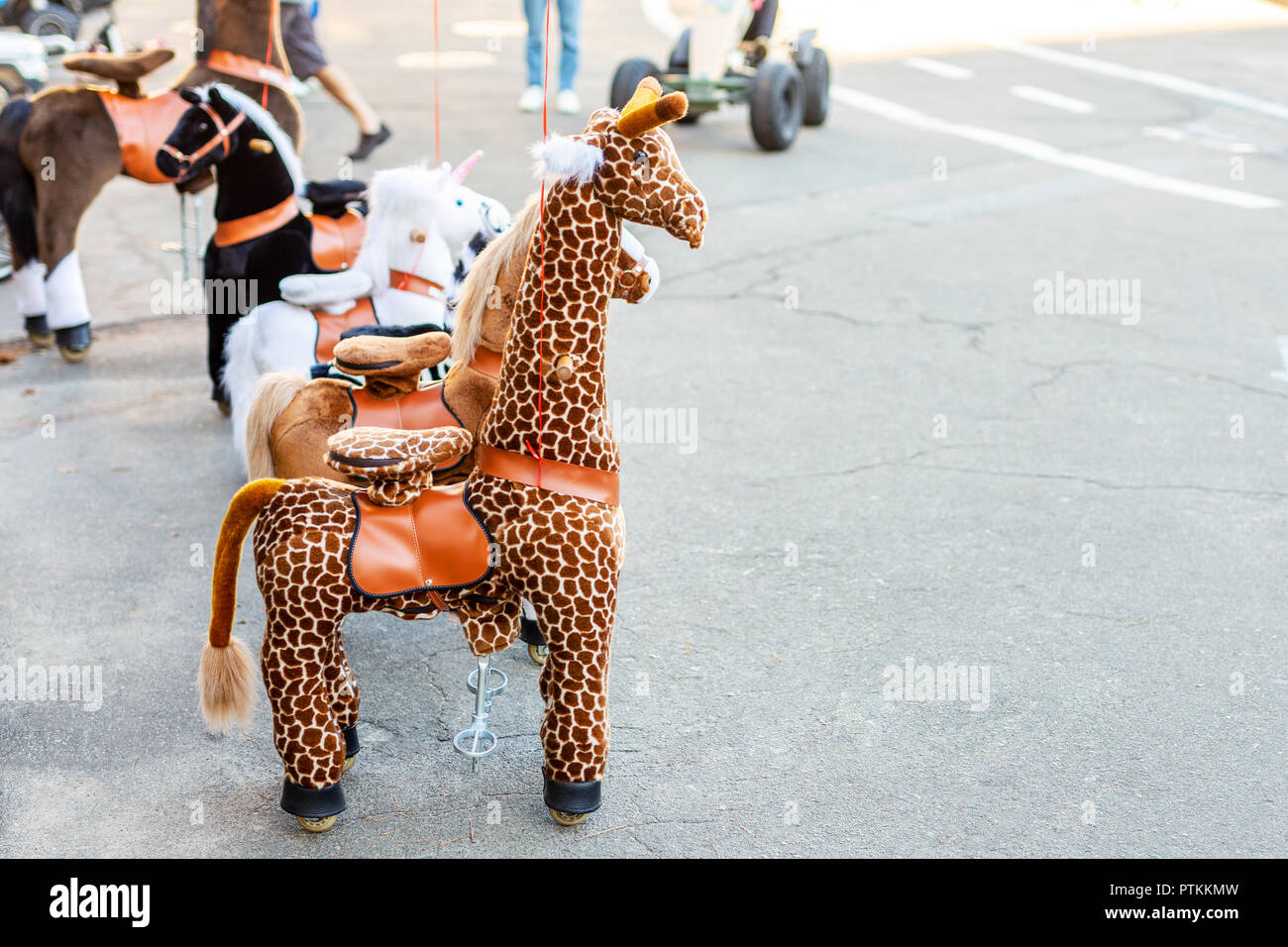 Group of large wheeled animal toys for riding. Children fun transport ...