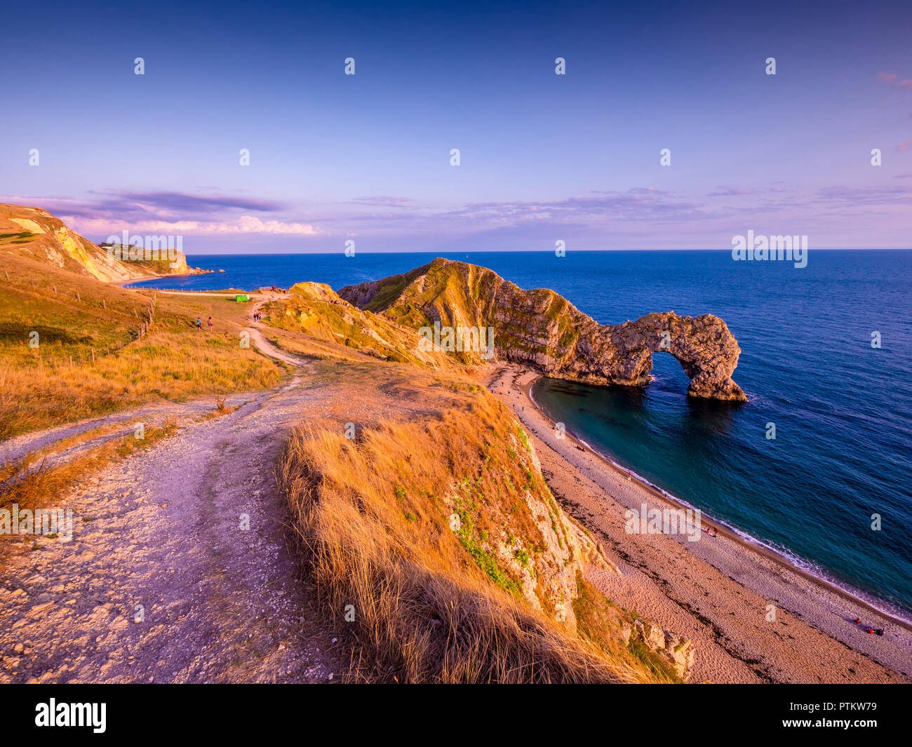 Sunset over Durdle Door - the most famous landmark in Devon England ...
