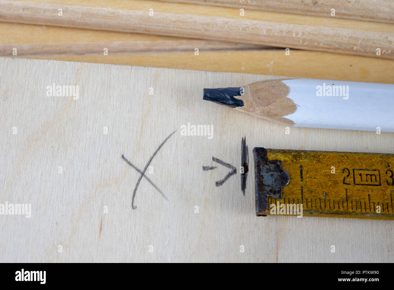 Carpenter's measure and pencil on a workshop table. Measurement of ...