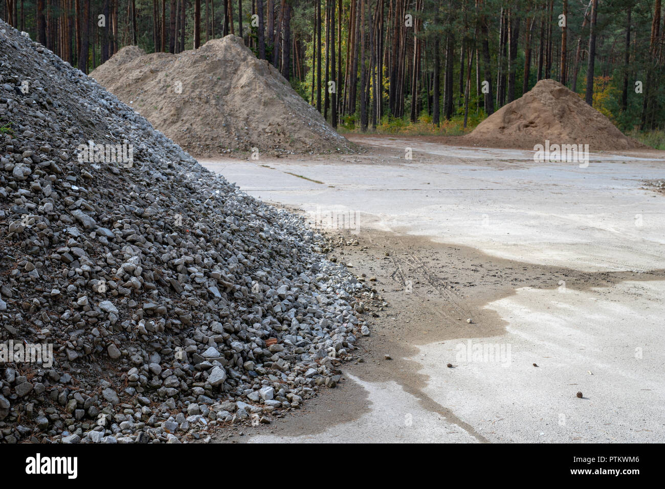 A heap of sand on a concrete square. Count of material for builders in ...