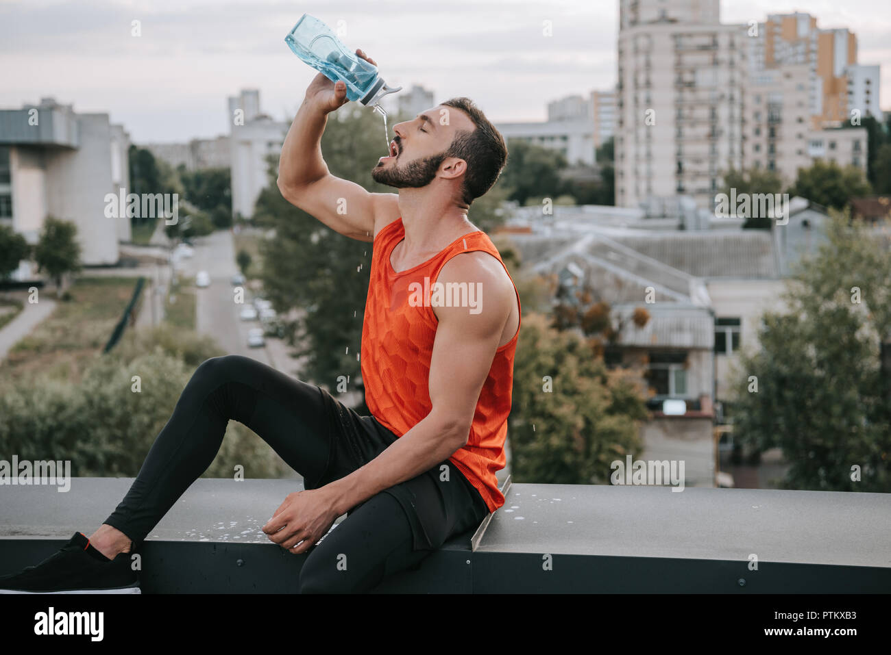 Handsome athlete drinking out hi-res stock photography and images - Alamy
