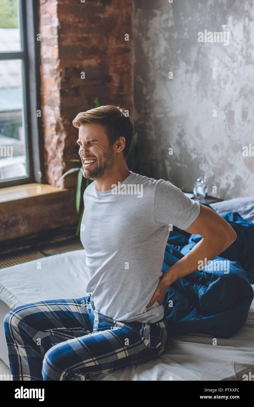 Man sitting up in bed hi-res stock photography and images - Alamy