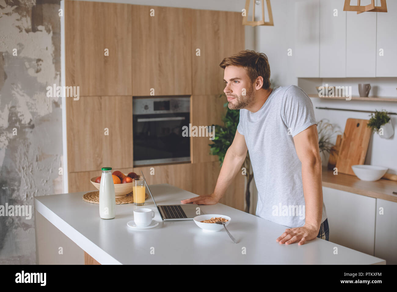 Man standing breakfast table hi-res stock photography and images - Alamy