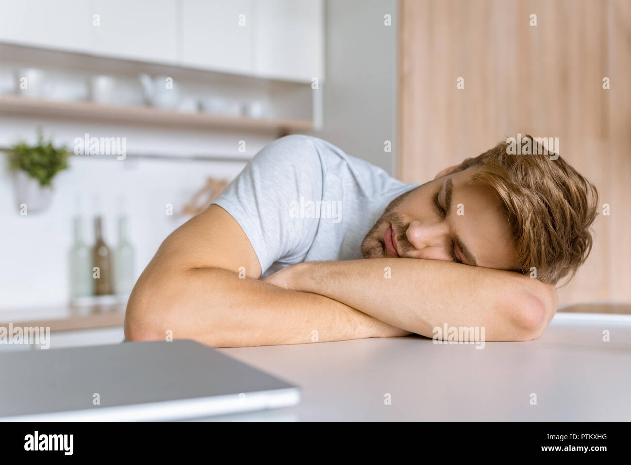 Laptop home sleeping man hi-res stock photography and images - Alamy