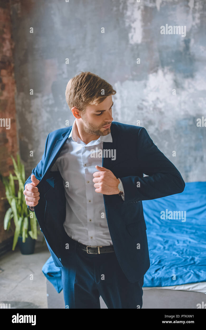 Putting On Jacket High Resolution Stock Photography and Images - Alamy