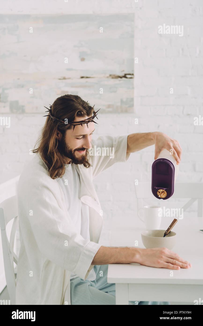 Handsome man pouring cornflakes bowl hi-res stock photography and ...