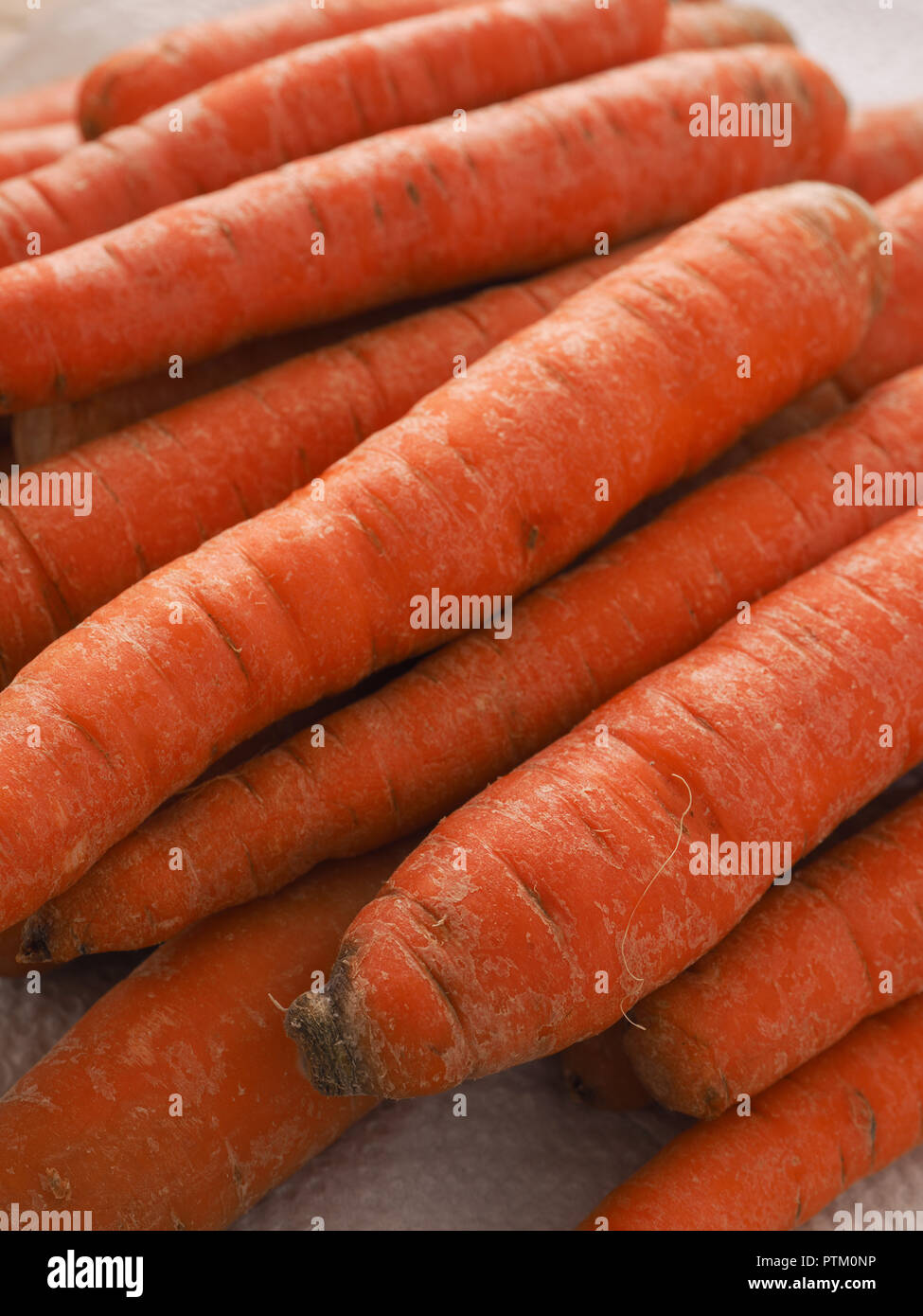Organic carrots on a kitchen table, close up shot Stock Photo - Alamy