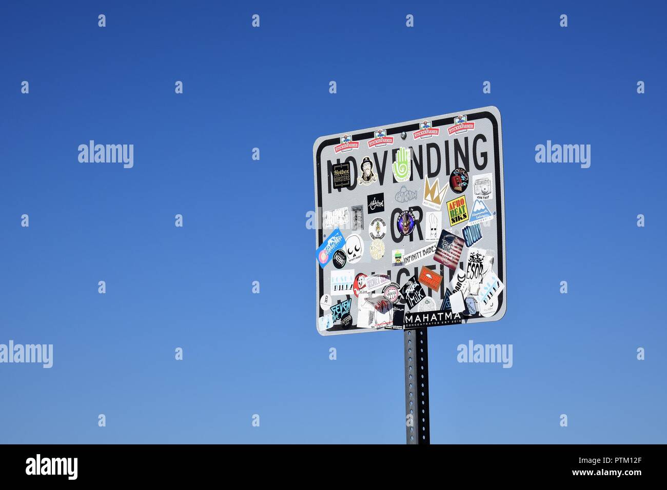 Defaced Street signs for handicapped and informational concepts with ...