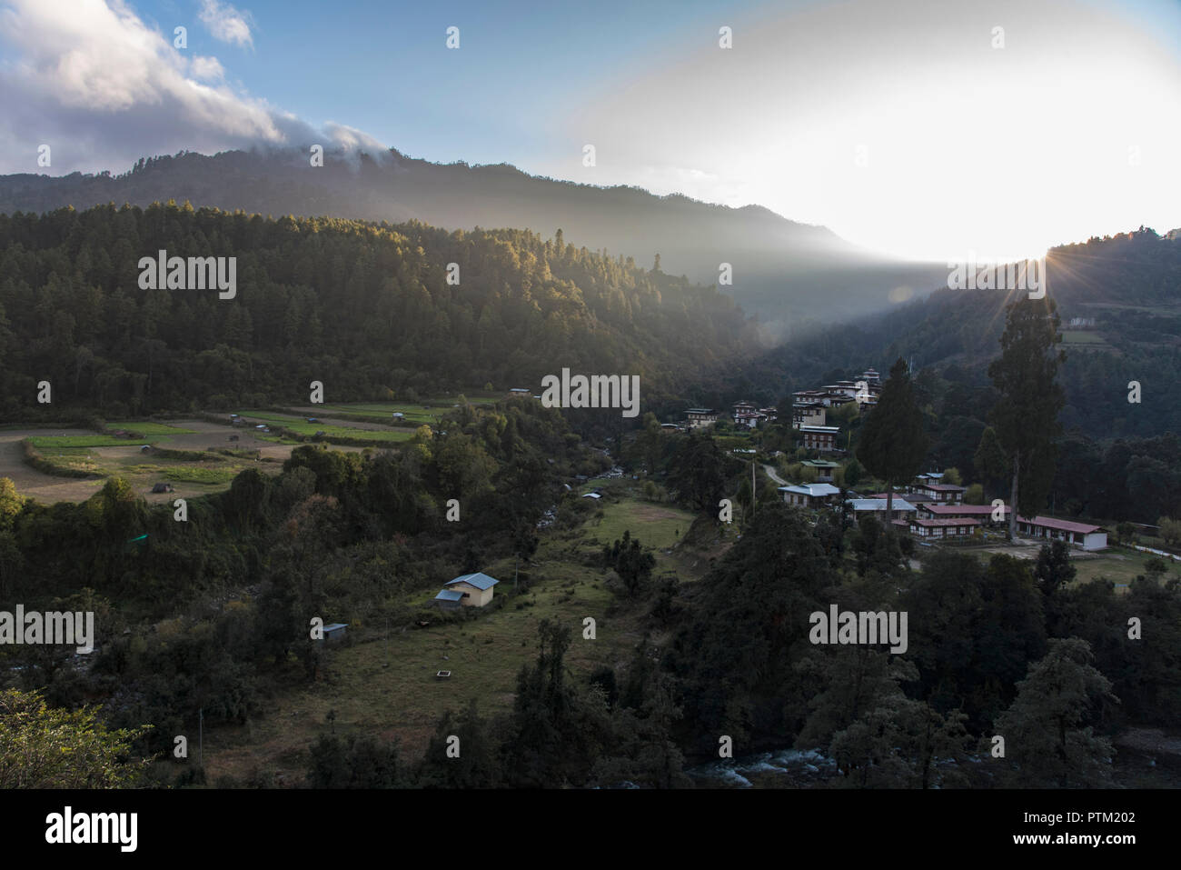 Sunset over a traditional mountain village in Bhutan Stock Photo - Alamy
