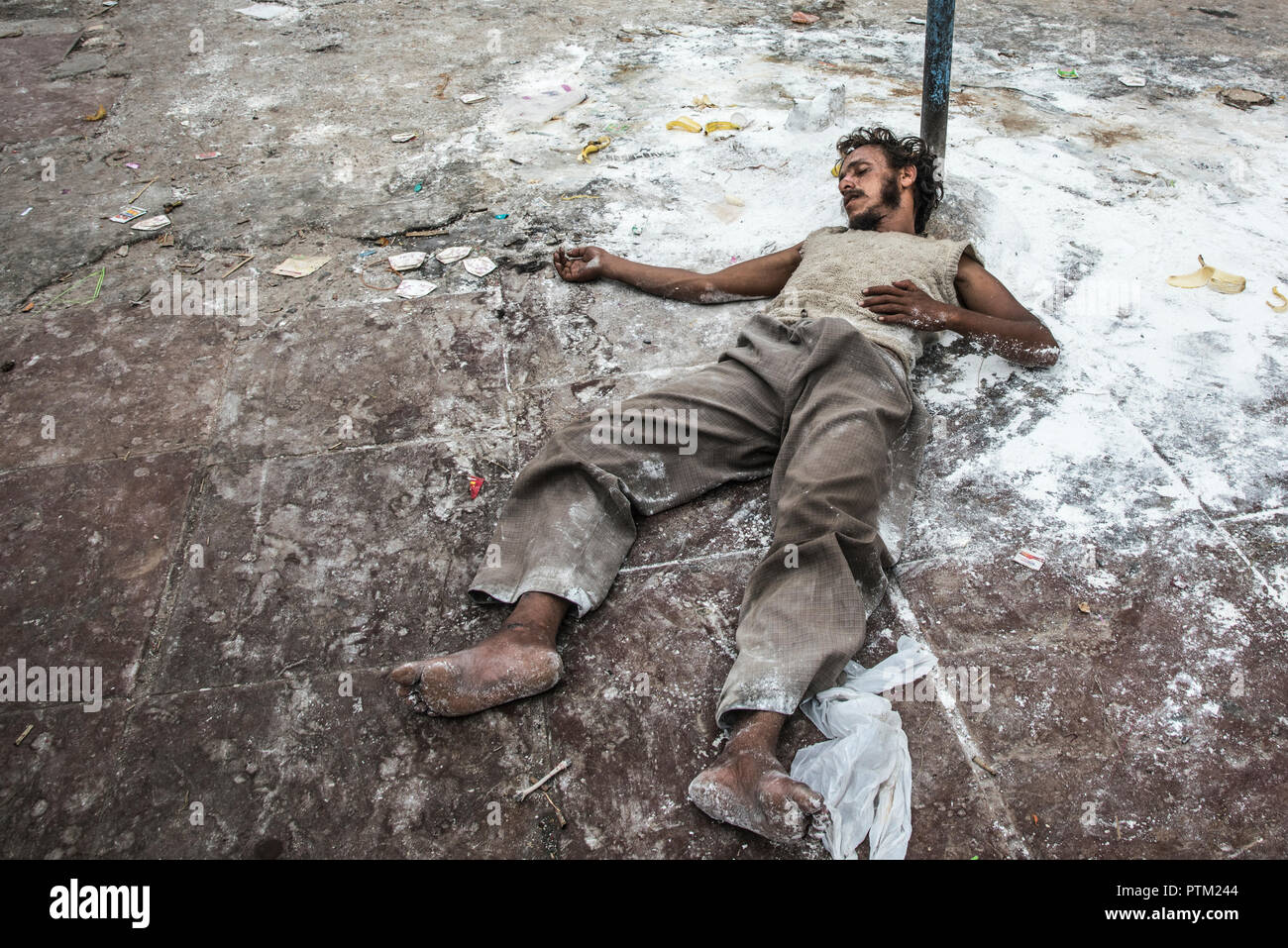 Homeless man sleeping on floor hi-res stock photography and images - Alamy