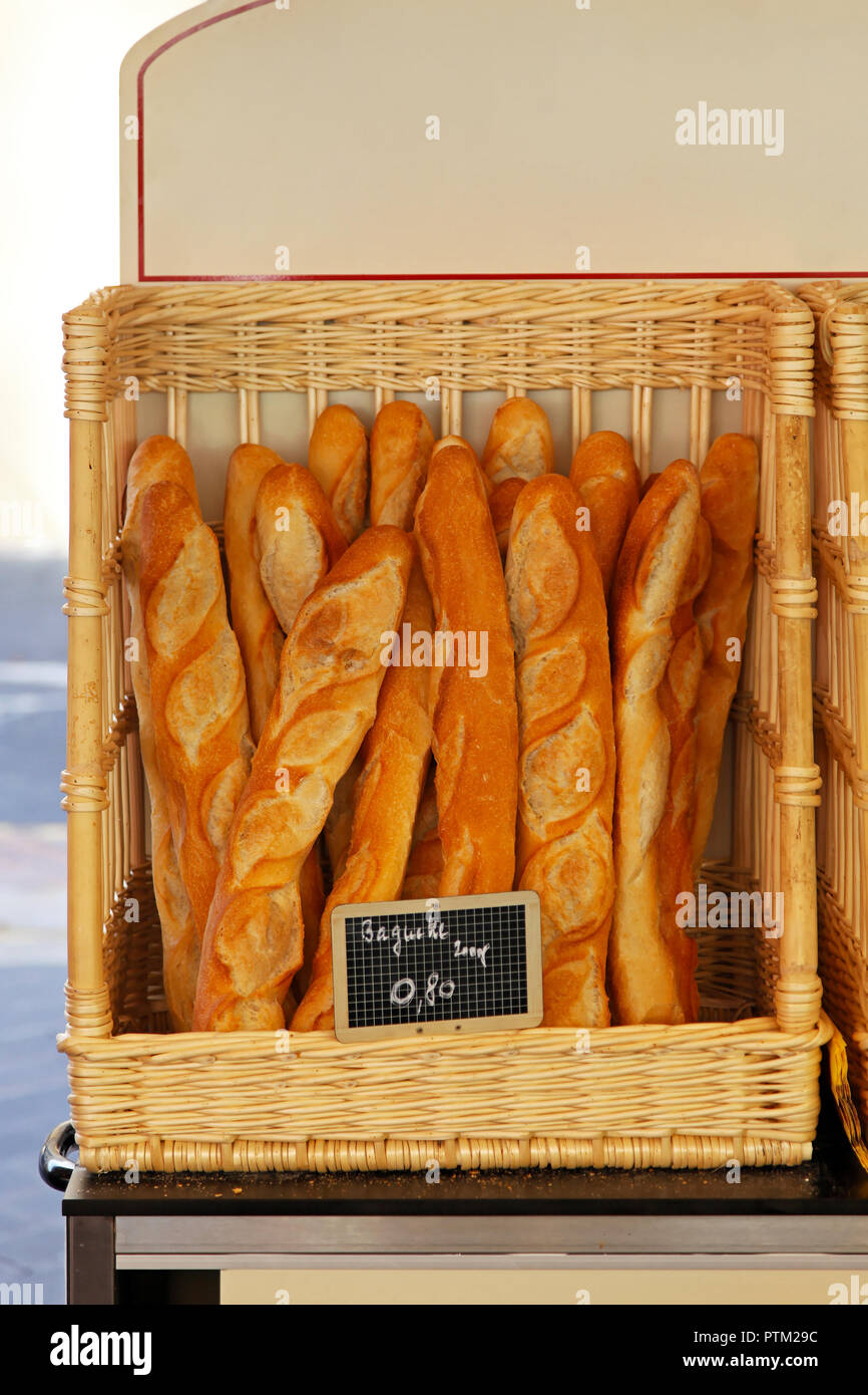 Traditional French baquette bread in the basket Stock Photo - Alamy