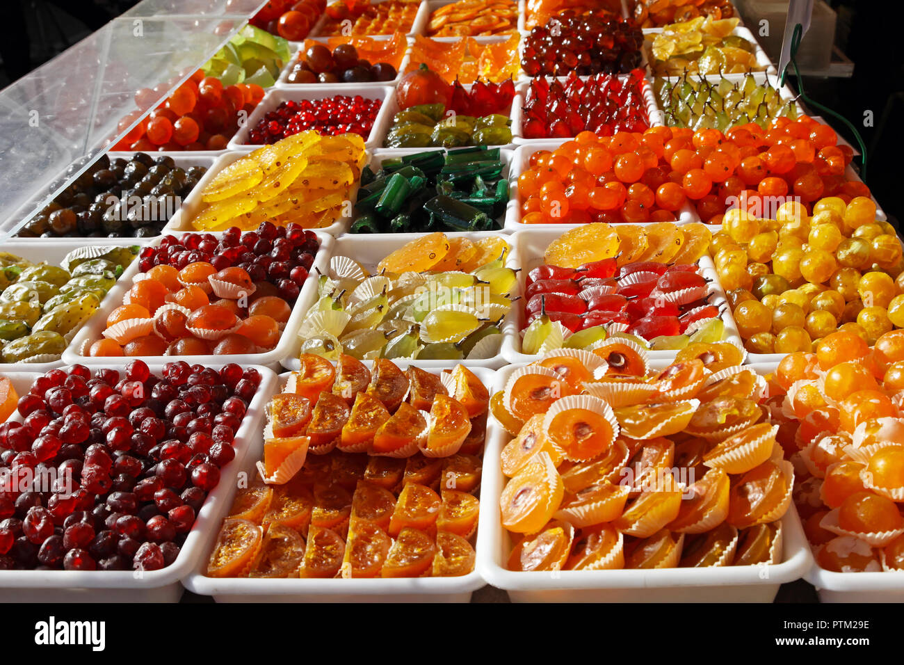 Sweet treats candied fruits at market Stock Photo - Alamy