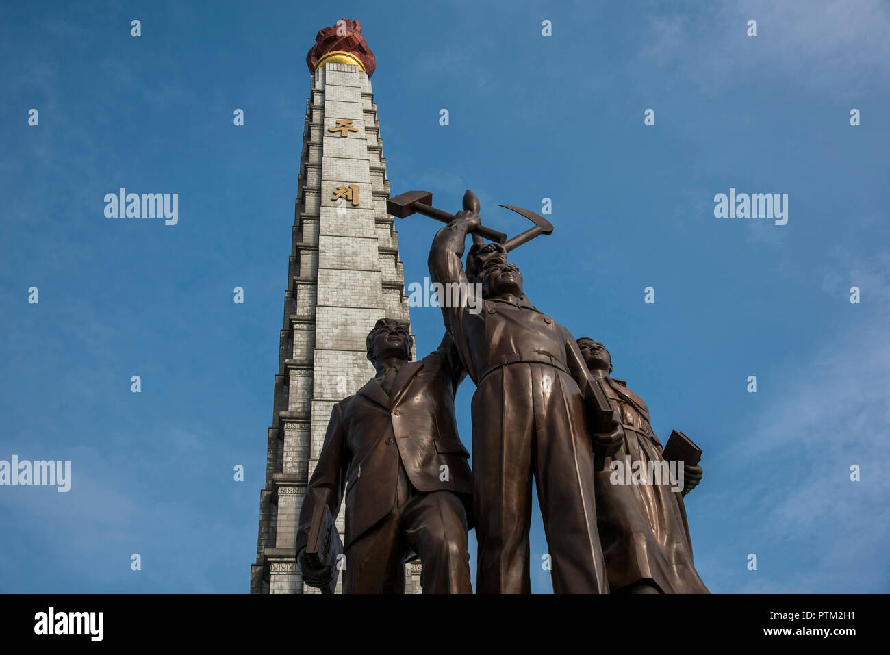 Communist revolutionary statue by the Juche Tower in Pyongyang in North ...