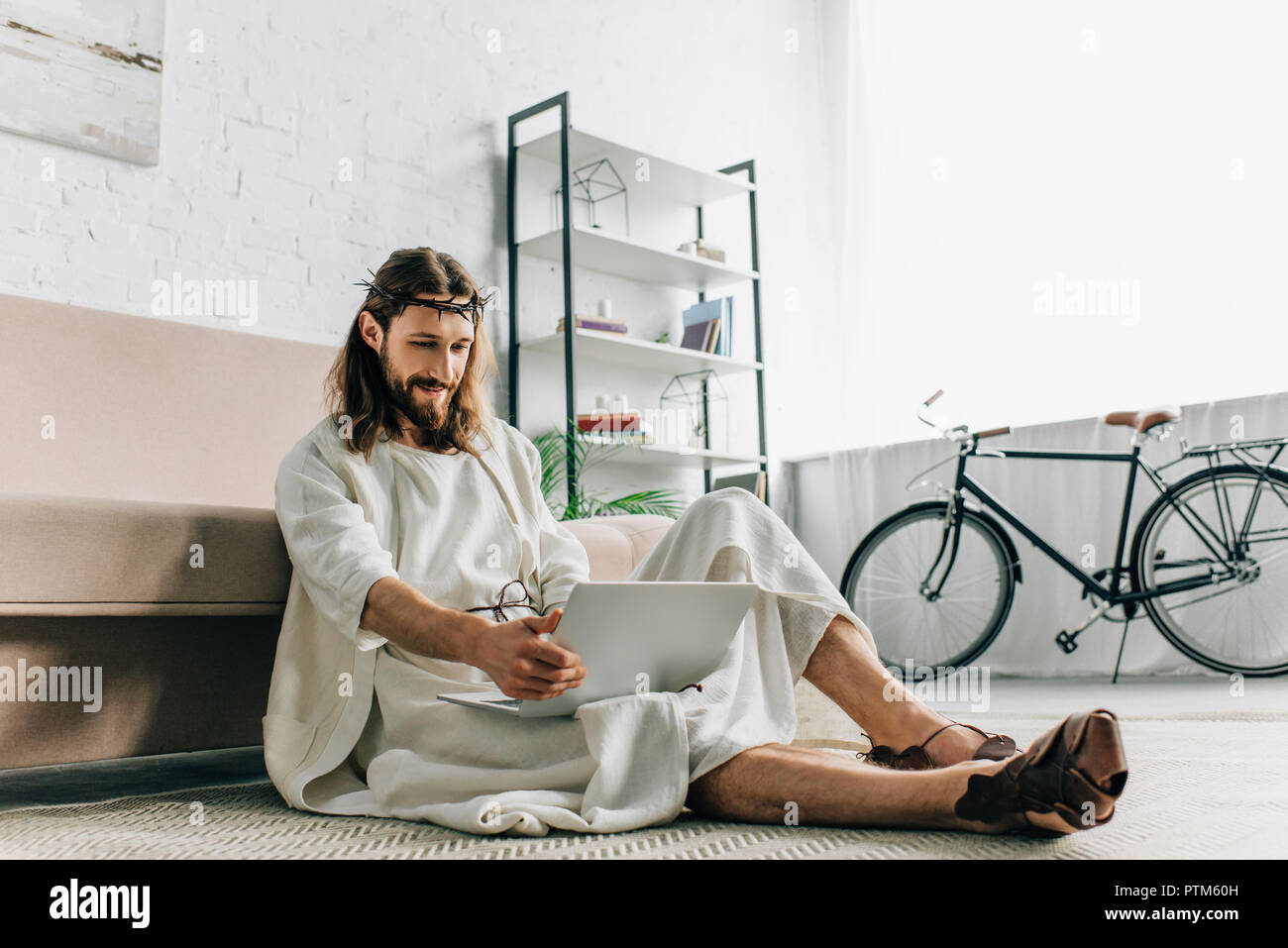 Young jesus using laptop hi-res stock photography and images - Alamy