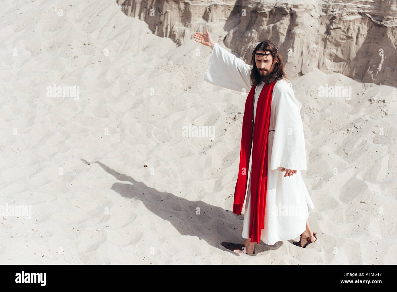 high angle view of Jesus in robe, red sash and crown of thorns showing ...