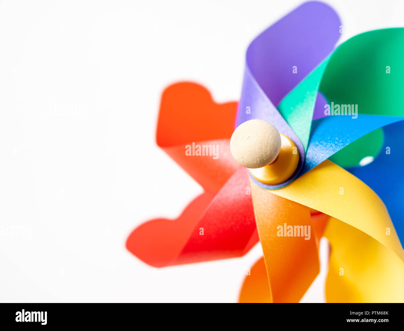 Close-up colorful pinwheel isolated on white background with copy space ...