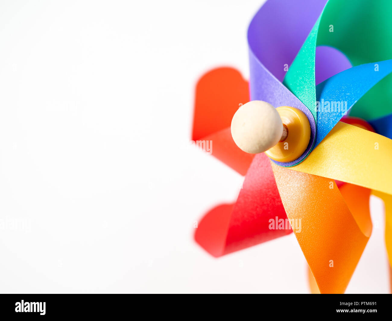 Close-up colorful pinwheel isolated on white background with copy space ...