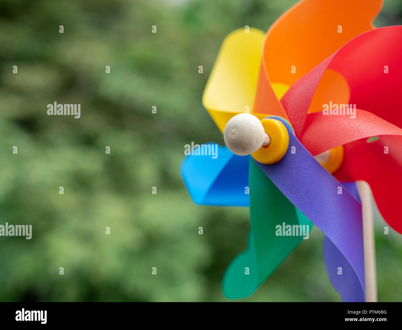 Colorful pinwheel on green nature background with copy space Stock ...