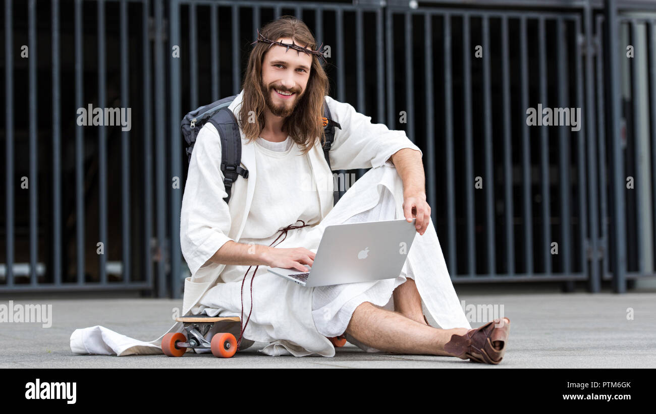 Young jesus using laptop hi-res stock photography and images - Alamy