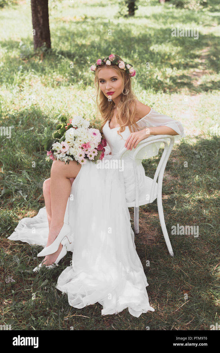 Bride sitting on chair hi-res stock photography and images - Alamy