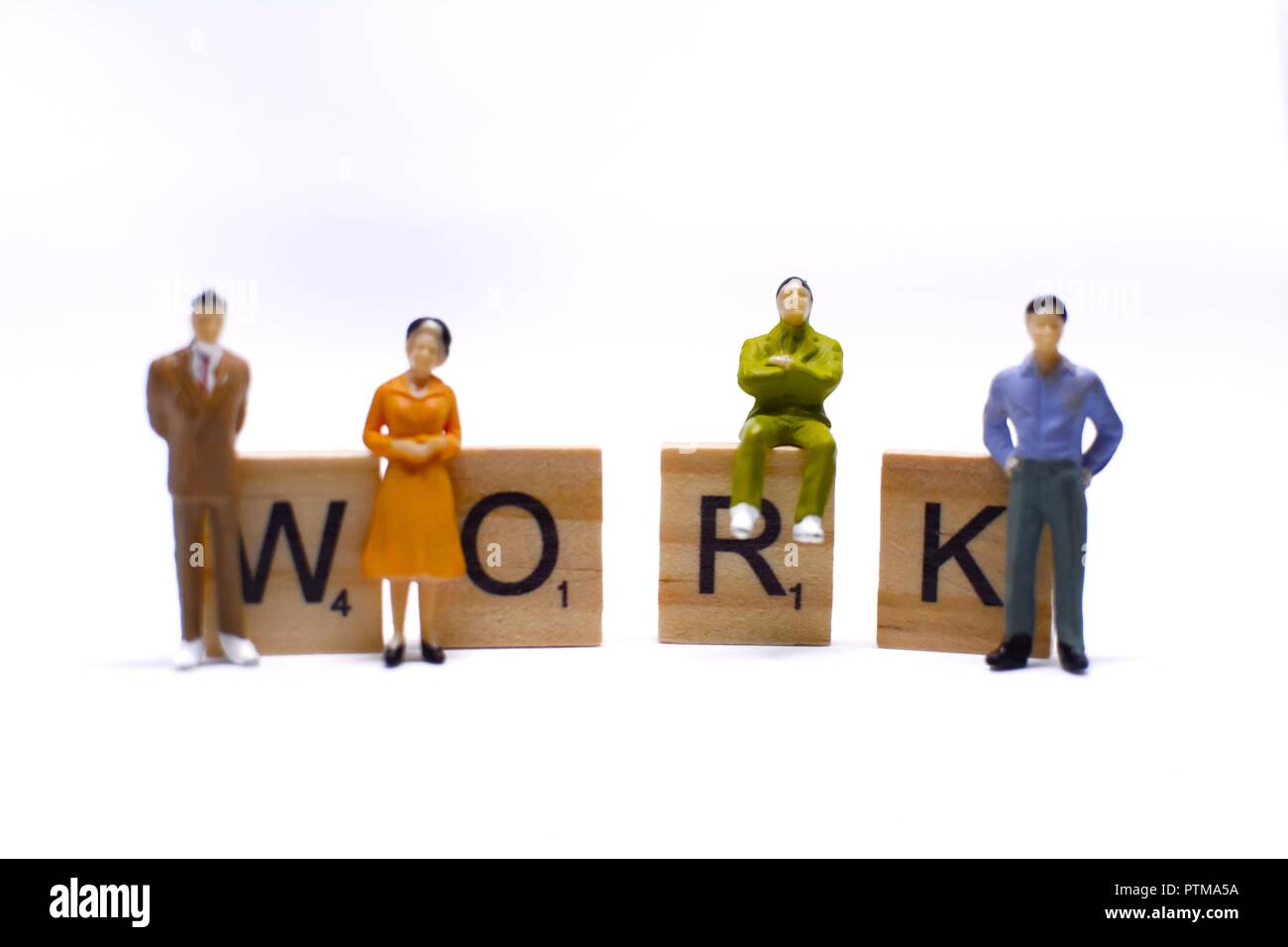 Miniature of worker model and the wooden alphabets with word WORK, the ...