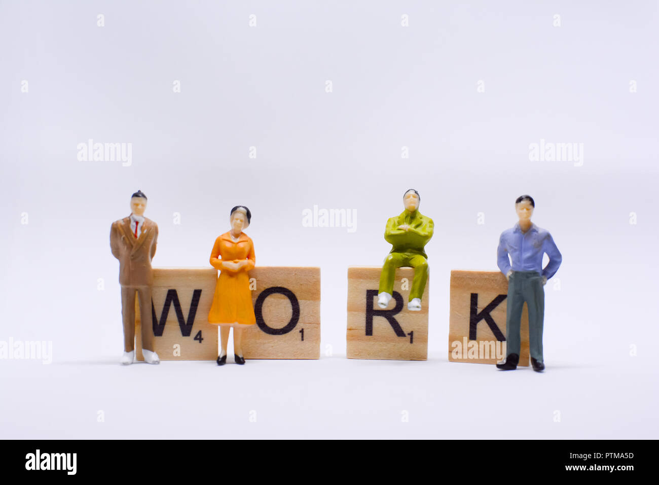 Miniature of worker model and the wooden alphabets with word WORK, the ...