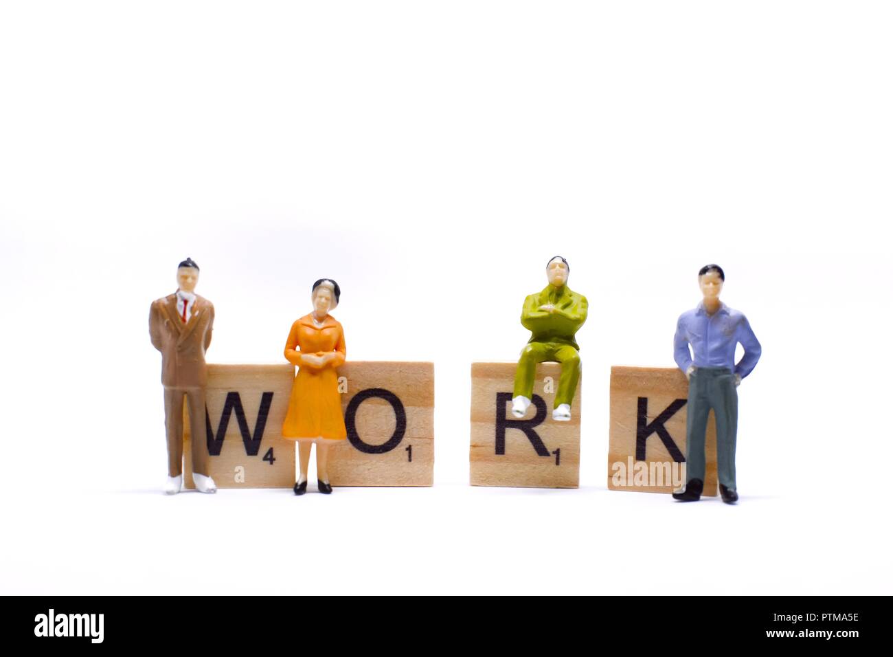 Miniature of worker model and the wooden alphabets with word WORK, the ...